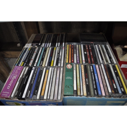 2 BOXES OF MIXED CDS