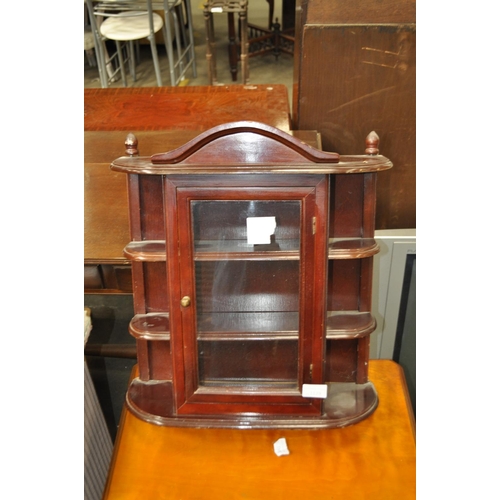 A DECORATIVE WALL-MOUNTED WOODEN DISPLAY CASE