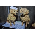 A PAIR OF DETAILED CAST RESIN GOLDEN RETRIEVER FIGURINES