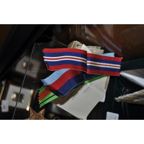 A BOX OF 4 X WW2 MEDALS AND RIBBONS