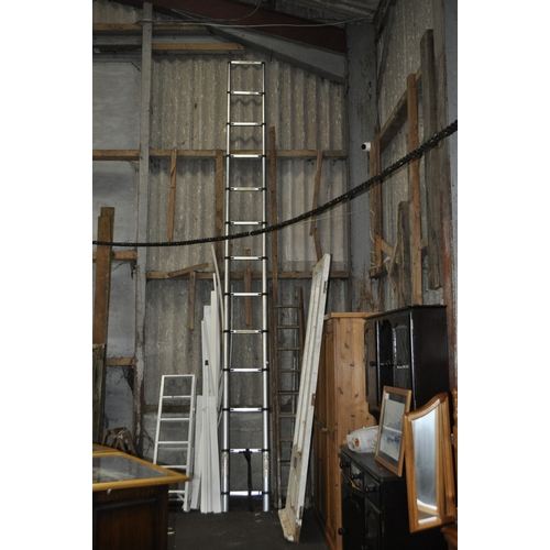 A VERY TALL PORTABLE TELESCOPIC EXTENDING ALUMINIUM 12 RUNG LADDER ...