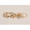 Four 9 carat yellow gold rings and a pair of 9 carat yellow gold ...