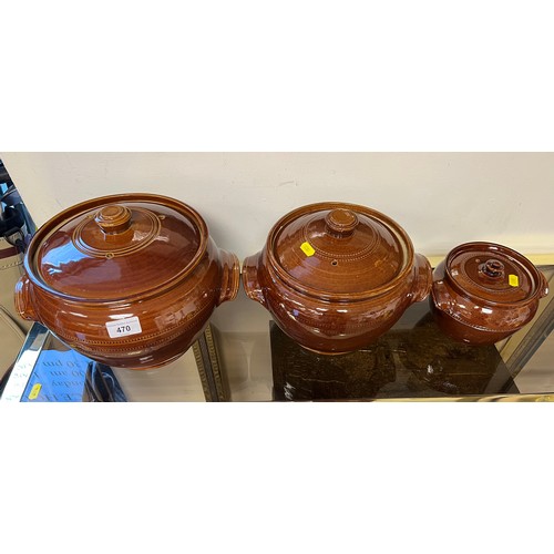 Three pottery pots with lids