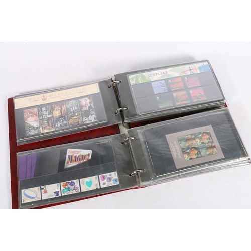 GB collection of around 40 mint stamp presentation packs including Lord ...