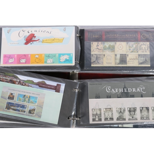 GB collection of around 40 mint stamp presentation packs including Lord ...