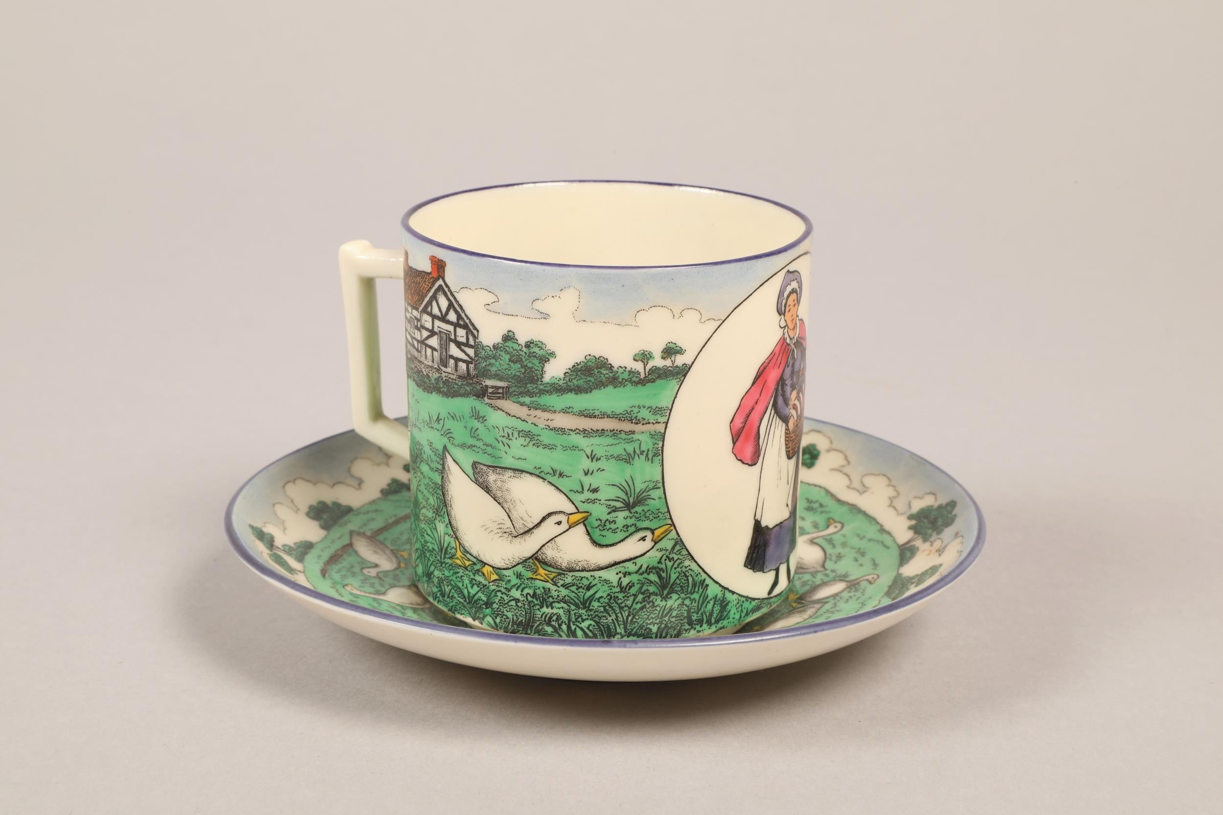 W. H. Goss porcelain cup and saucer; decorated with a lady and geese
