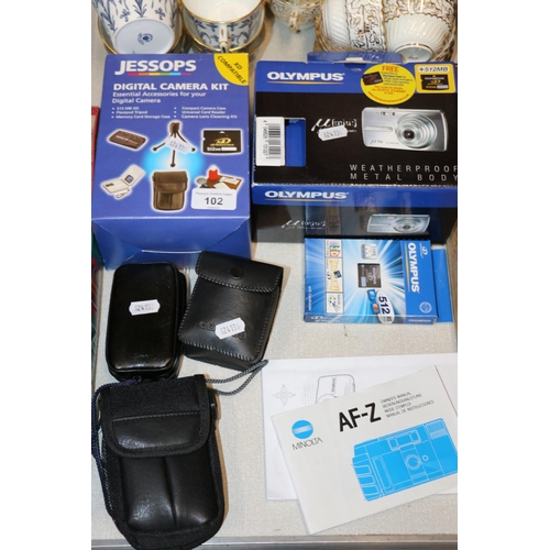 Olympus camera, boxed, a Jessops digital camera kit, and other cameras.