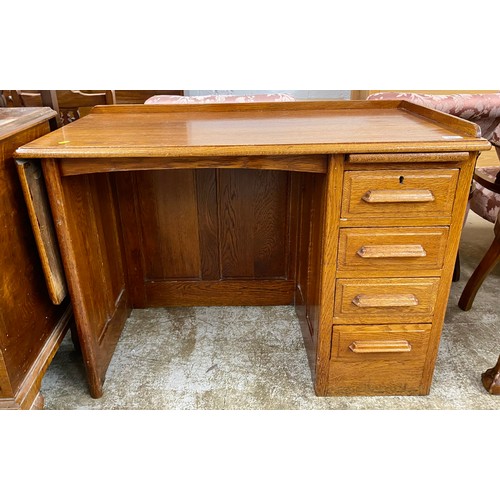 Single pedestal four drawer oak desk with drop leaf approx 75cm h