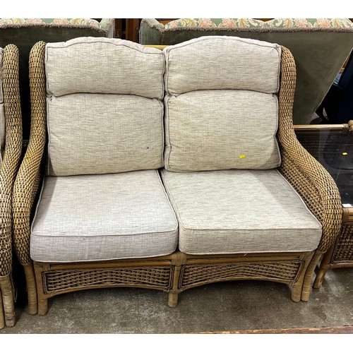 Conservatory two seater settee,three chairs,glass topped table & stool