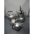 Two Picquot Ware teapots and three kettles.