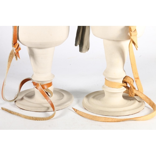 Pair of Scottish Helmsdale Pottery unglazed porcelain models of hooded ...