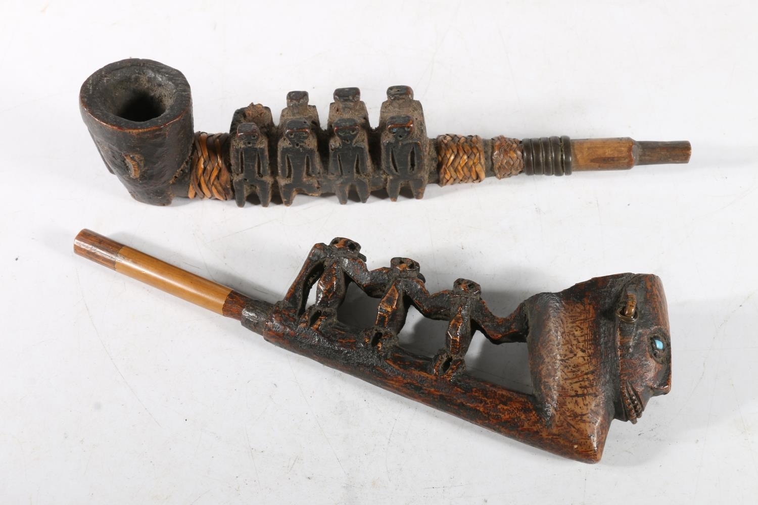 Two Burmese/Indian carved wooden smoking pipes, possibly of Naga origin ...