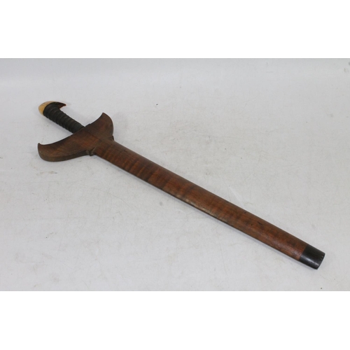 Malaysian kris with typical ornate flamberge blade, white metal wire ...