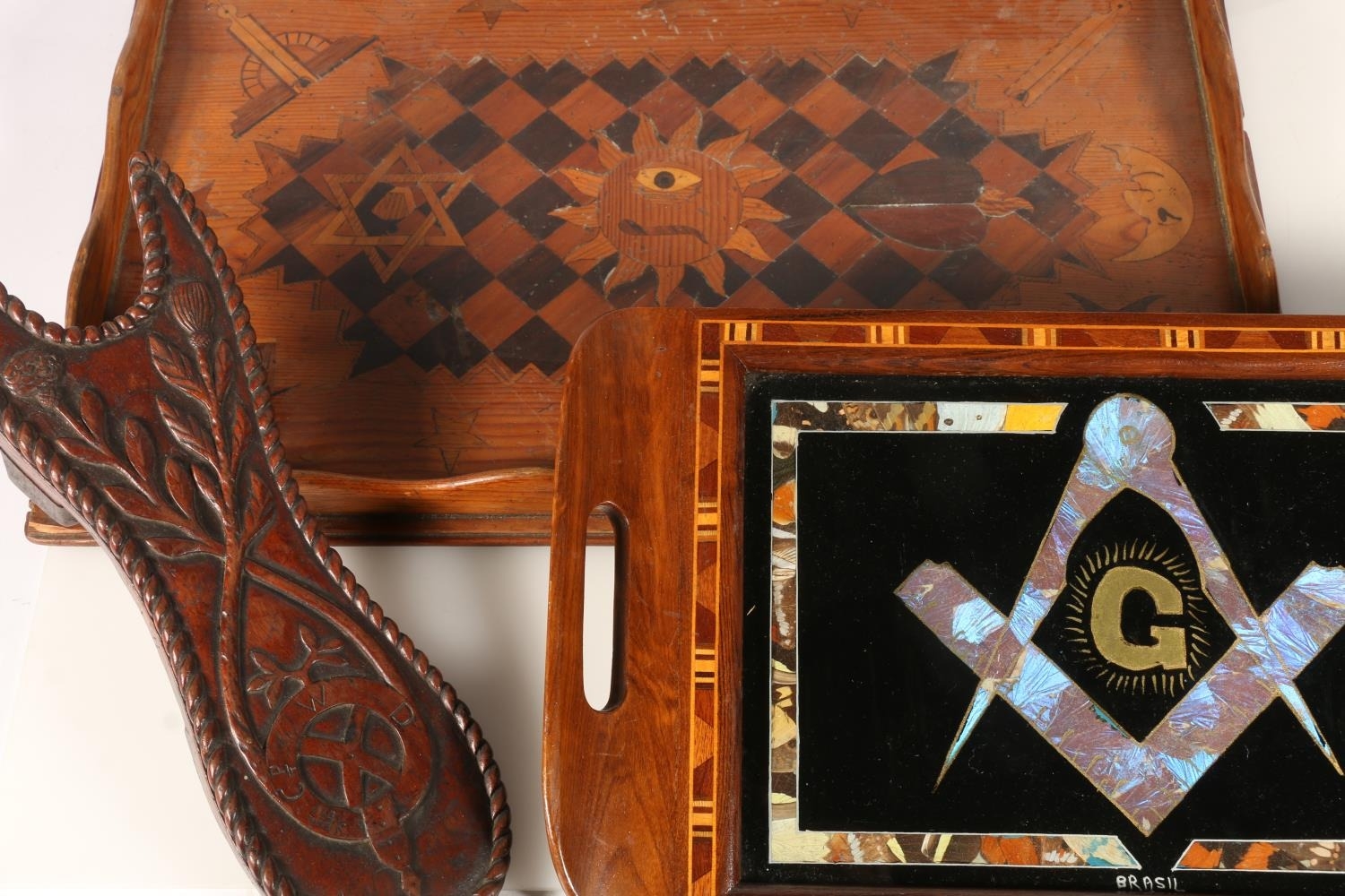 Masonic interest, a carved mahogany boot jack with thistle design, the ...