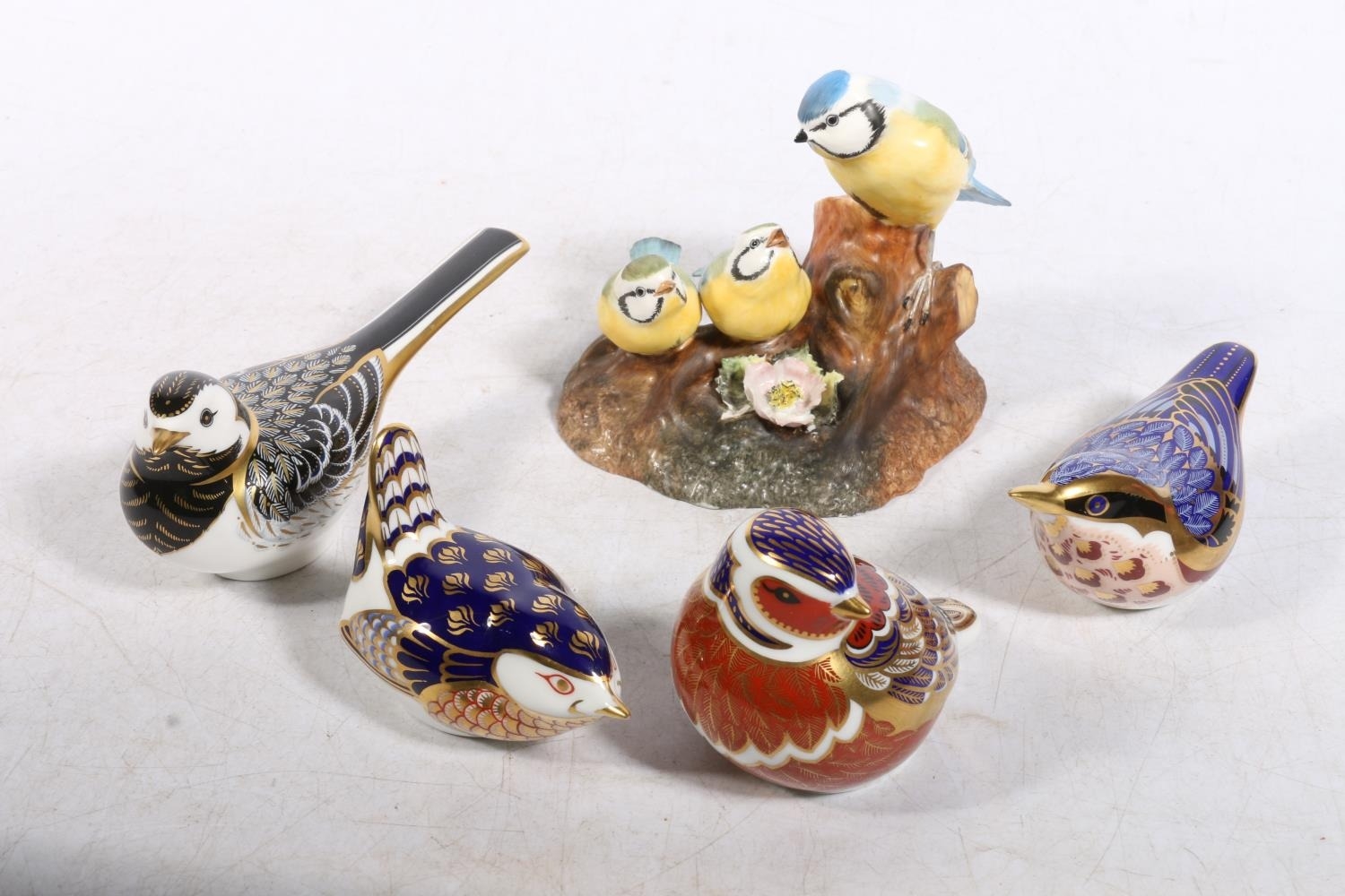 Four Royal Crown Derby bird paperweights and a Royal Crown Derby ...