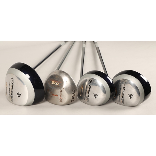 Four assorted golf clubs