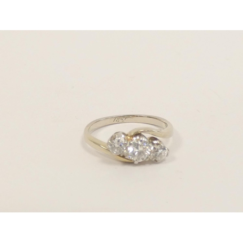 Diamond cross-over ring with three brilliants, the largest approx .30ct ...