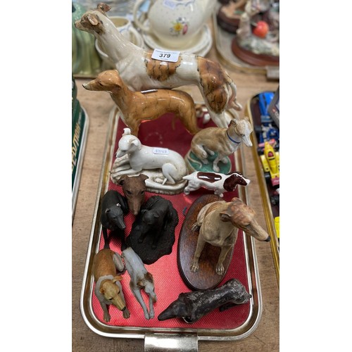 Collection of whippet and greyhound figurines, and a Beswick spaniel