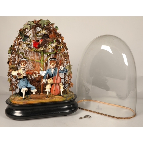 Antique musical automaton under a glass dome, two monkey musicians, a ...