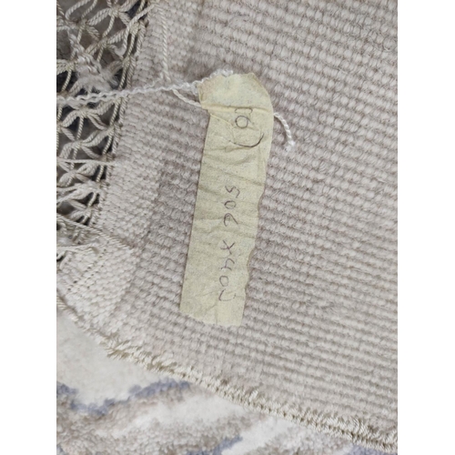 Indian style muted silk and wool carpet with central white floral panel ...