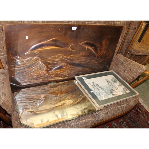 Repousse copper panel and a bevel edged frameless wall mirror and a picture