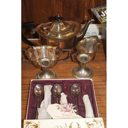 Silver-plated three piece teaset, a pair of candlesticks and a boxed ...