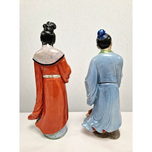 Pair of Chinese figures, character marks impressed to bases, each ...