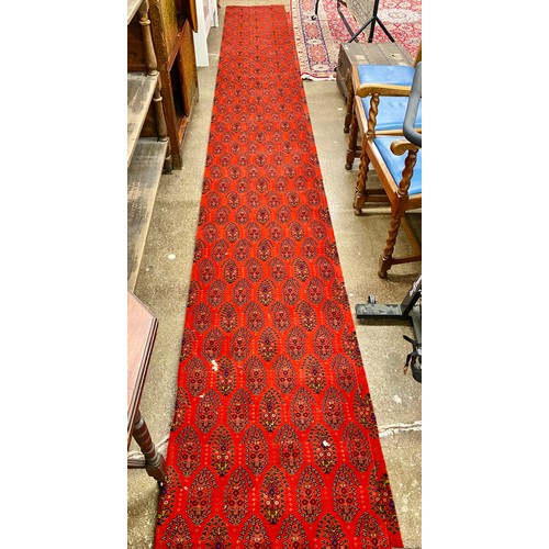 Two large red patterned hall runners