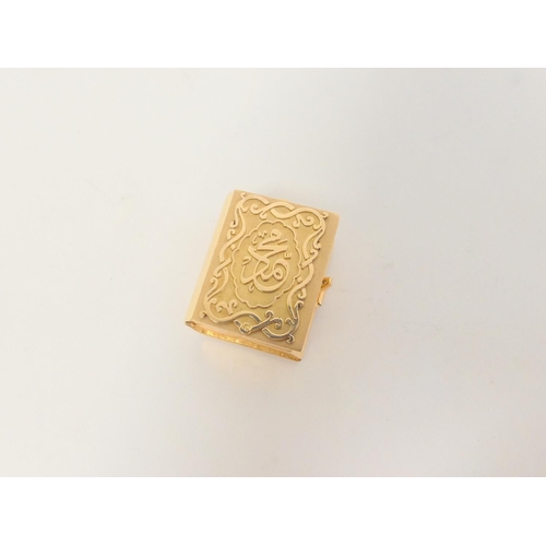Middle Eastern gold pendant with pierced sides containing a copy of the ...