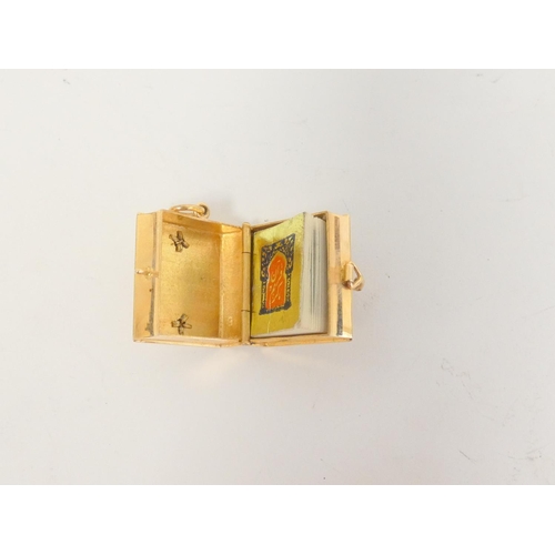 Middle Eastern gold pendant with pierced sides containing a copy of the ...
