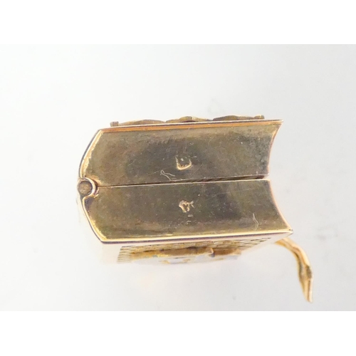 Middle Eastern gold pendant with pierced sides containing a copy of the ...