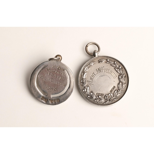 Two hallmarked silver medallions dated 1922 and 1945