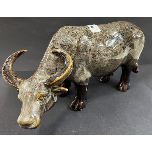 Brown mottled glazed model of an oxen, probably Chinese.