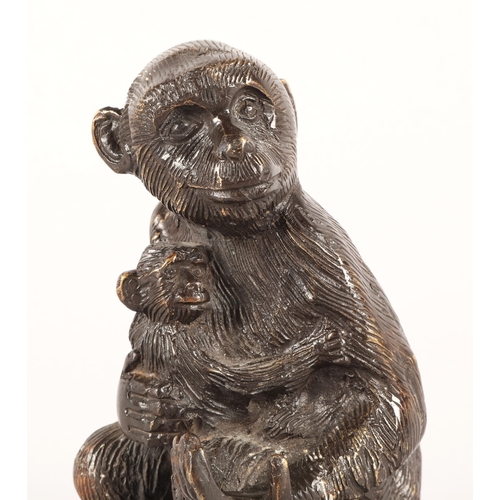 Bronze monkey figure holding its young. 18cm high