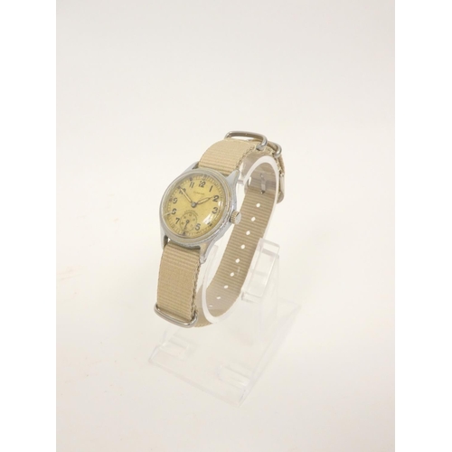 WW2 Timor ATP British field watch, the white dial having large arabic ...