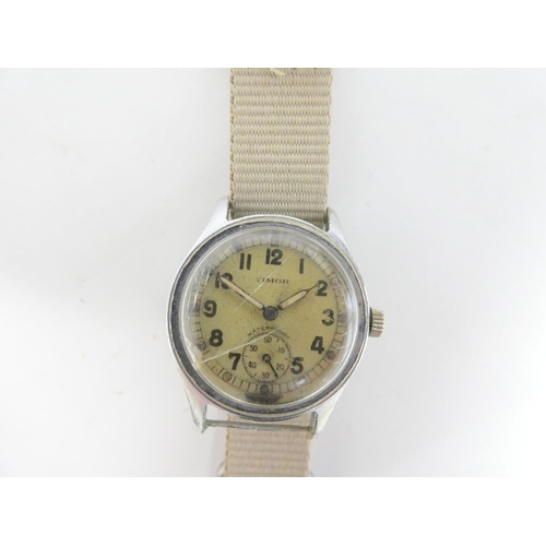 WW2 Timor ATP British field watch, the white dial having large arabic ...