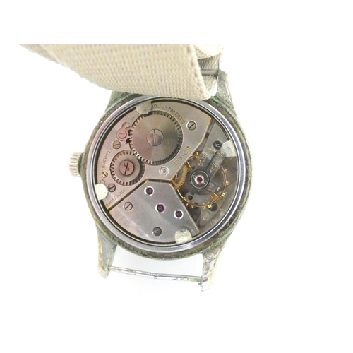WW2 Timor ATP British field watch, the white dial having large arabic ...