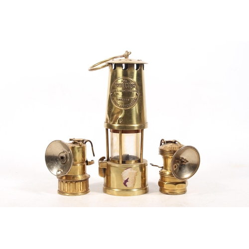 Brass miners' lamp 'The Protector' Eccles of Manchester and two other ...