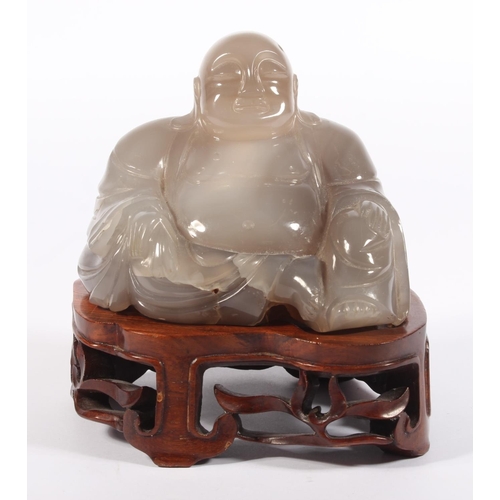 Chinese carved agate figure of a Buddha, modelled in seated position ...
