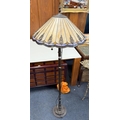 Reproduction lamp with leaded glass shade.