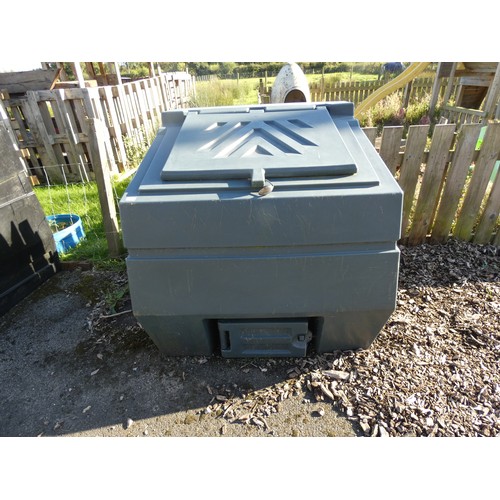 Large green plastic coal bunker.