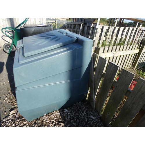 Large green plastic coal bunker.