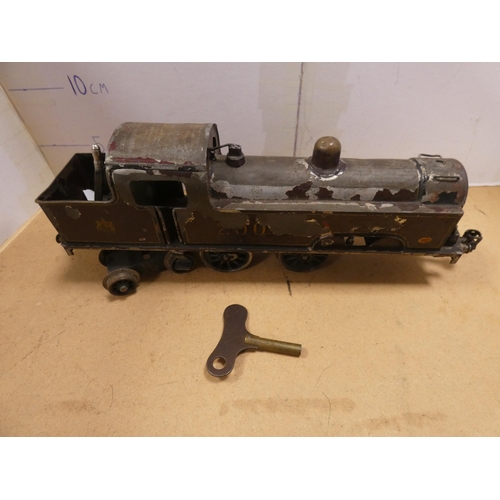 Clockwork locomotive, another locomotive, Mamod steam engine and a ...