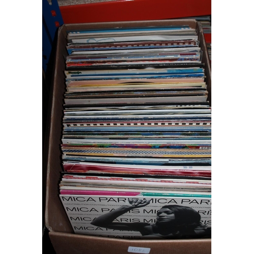 Box of mixed vinyl records.