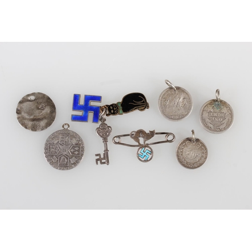Collection of small silver coins and a silver Swastika pendant and a ...