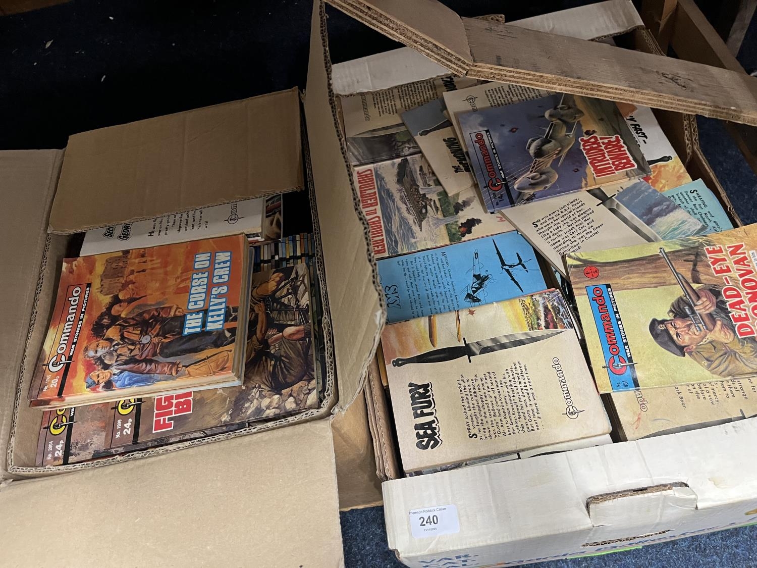Two boxes containing Commando books.