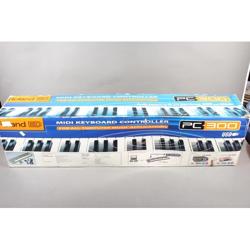 Roland Midi keyboard controller with box.