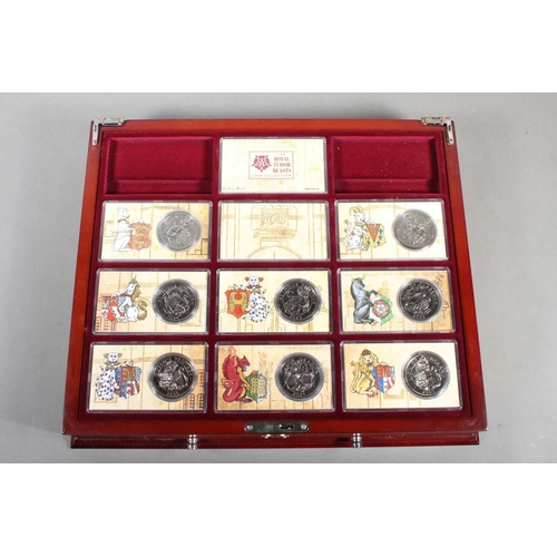 The Danbury Mint 'Royal Tudor Beast Coin Collection' comprising eight ...