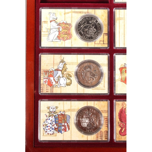 The Danbury Mint 'Royal Tudor Beast Coin Collection' comprising eight ...