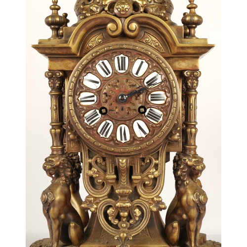 Victorian ornate brass mantel clock, with double fish finials, the dial ...